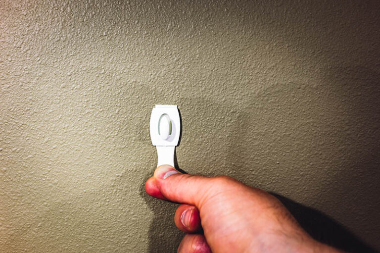 4 Expert Tips on How to Hang Pictures Without Nails | Home Grail